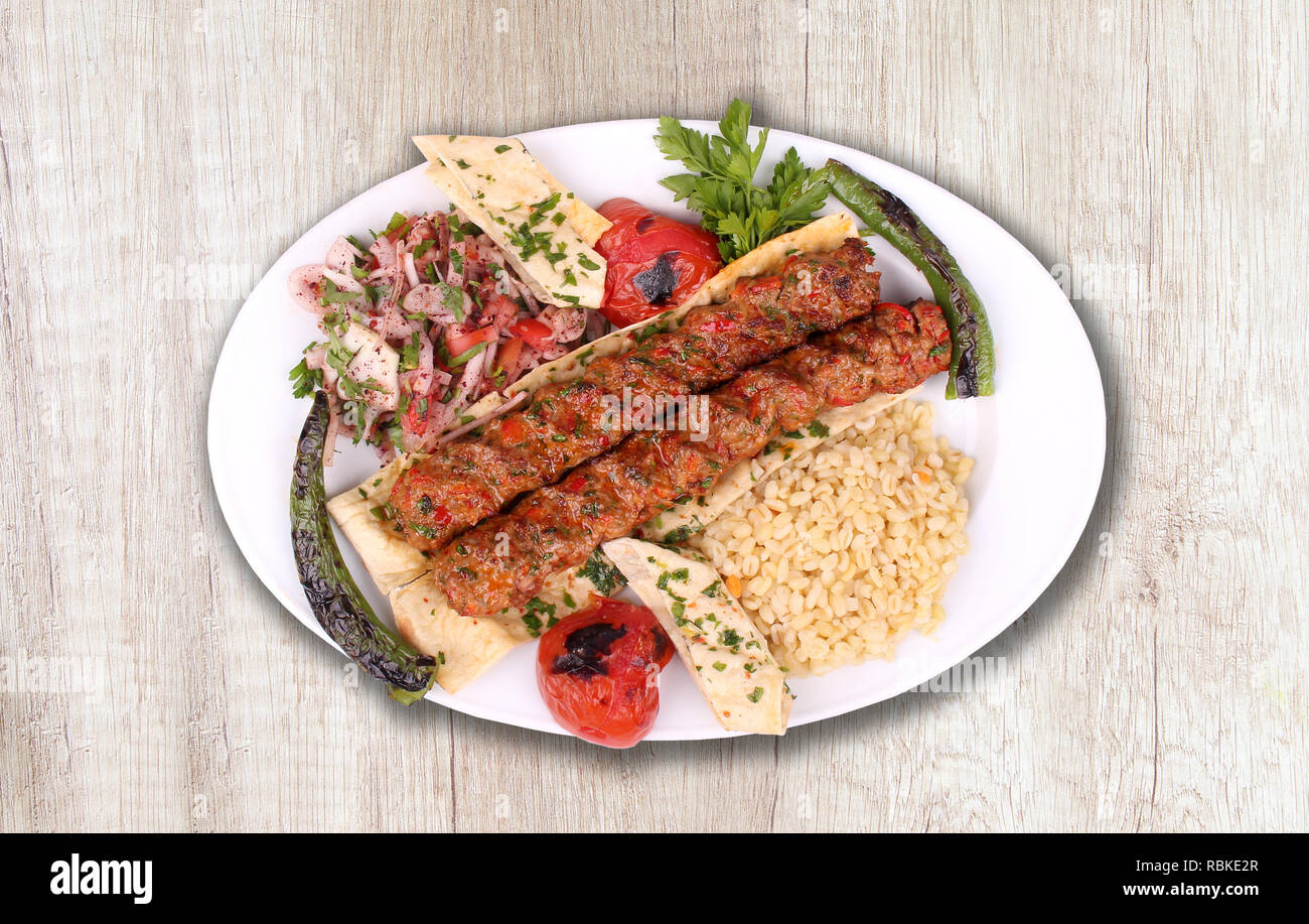 kebab plate on wooden floor S Stock Photo - Alamy