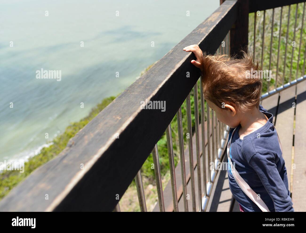People looking out and enjoying the cool ocean breeze at Turtle lookout ...
