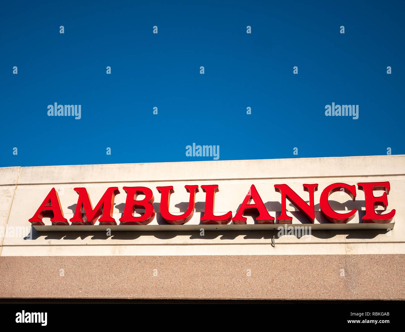 Looking Up at an Ambulance Sign With clear Skies Stock Photo - Alamy