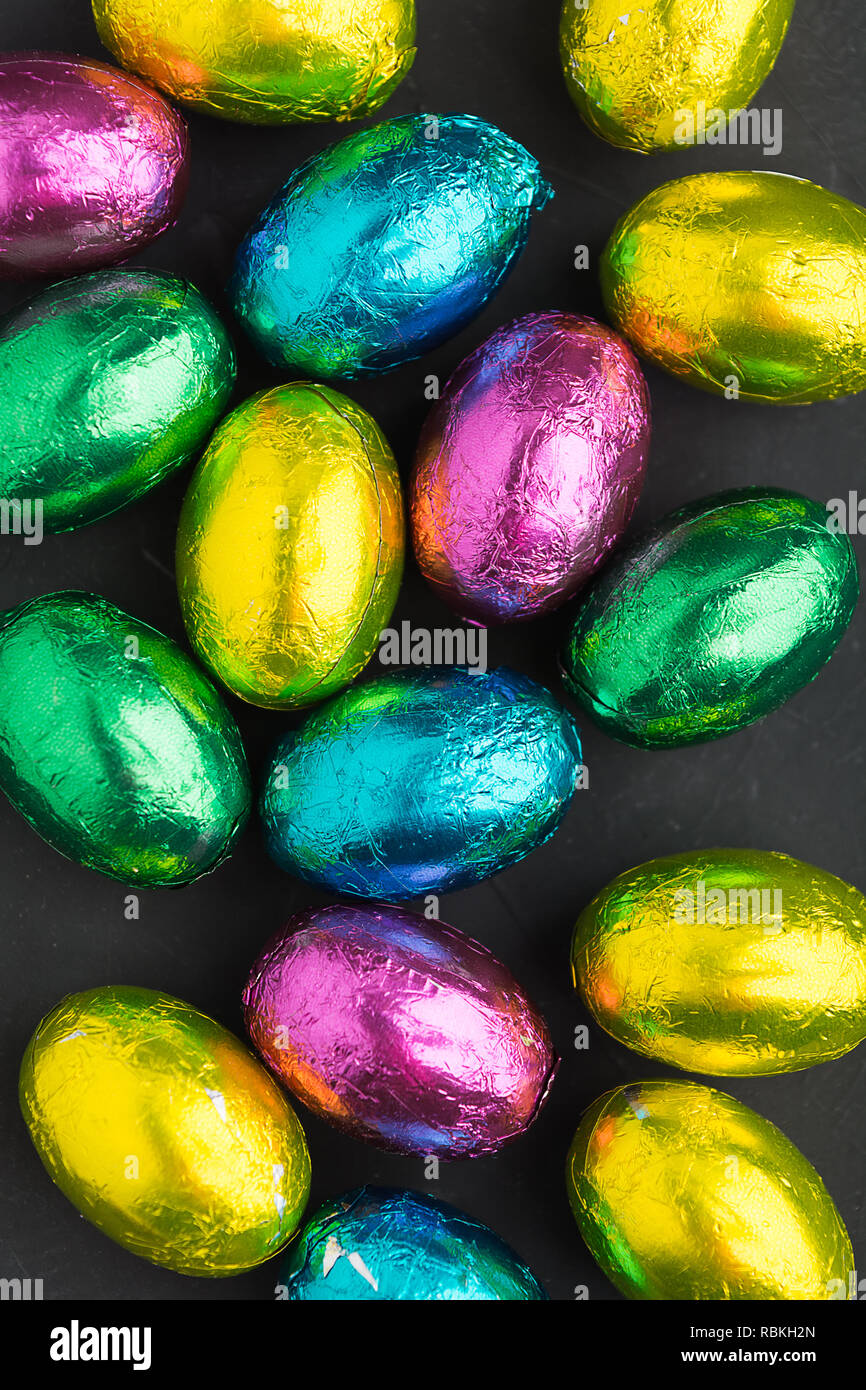 Colorful sweet eggs in niggly wiggly texture over grey background Stock ...