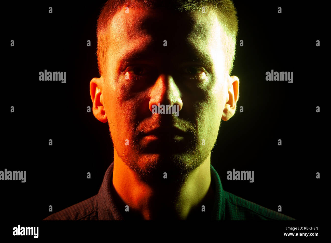 Close-up of the face of an unshaven face of a man with stubble, dressed ...