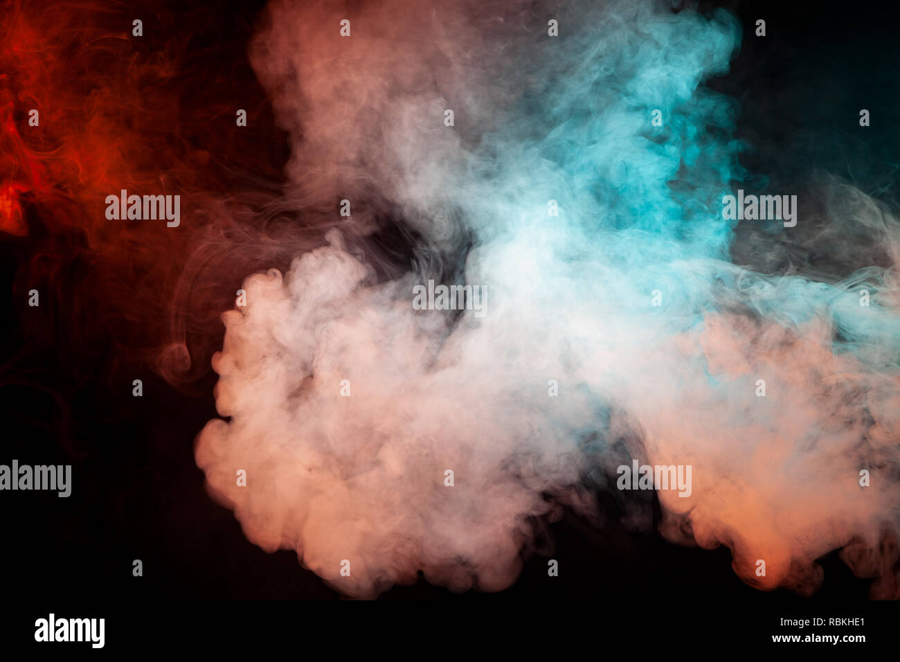 Background of green, white and pink wavy smoke on a black isolated ...