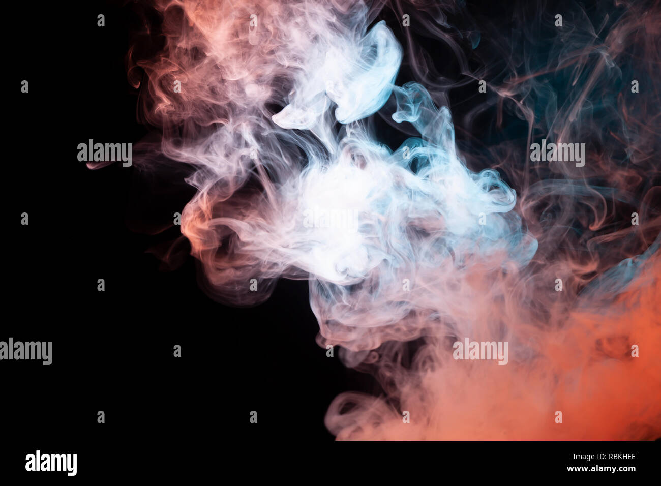 Background of blue, white and pink wavy smoke on a black isolated ...