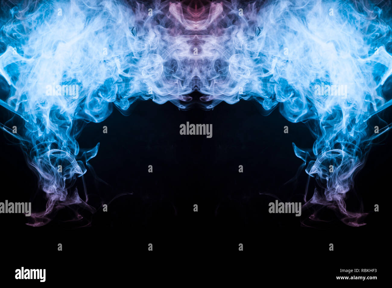 A background of pink, blue and white wavy smoke in the shape of a ghost ...