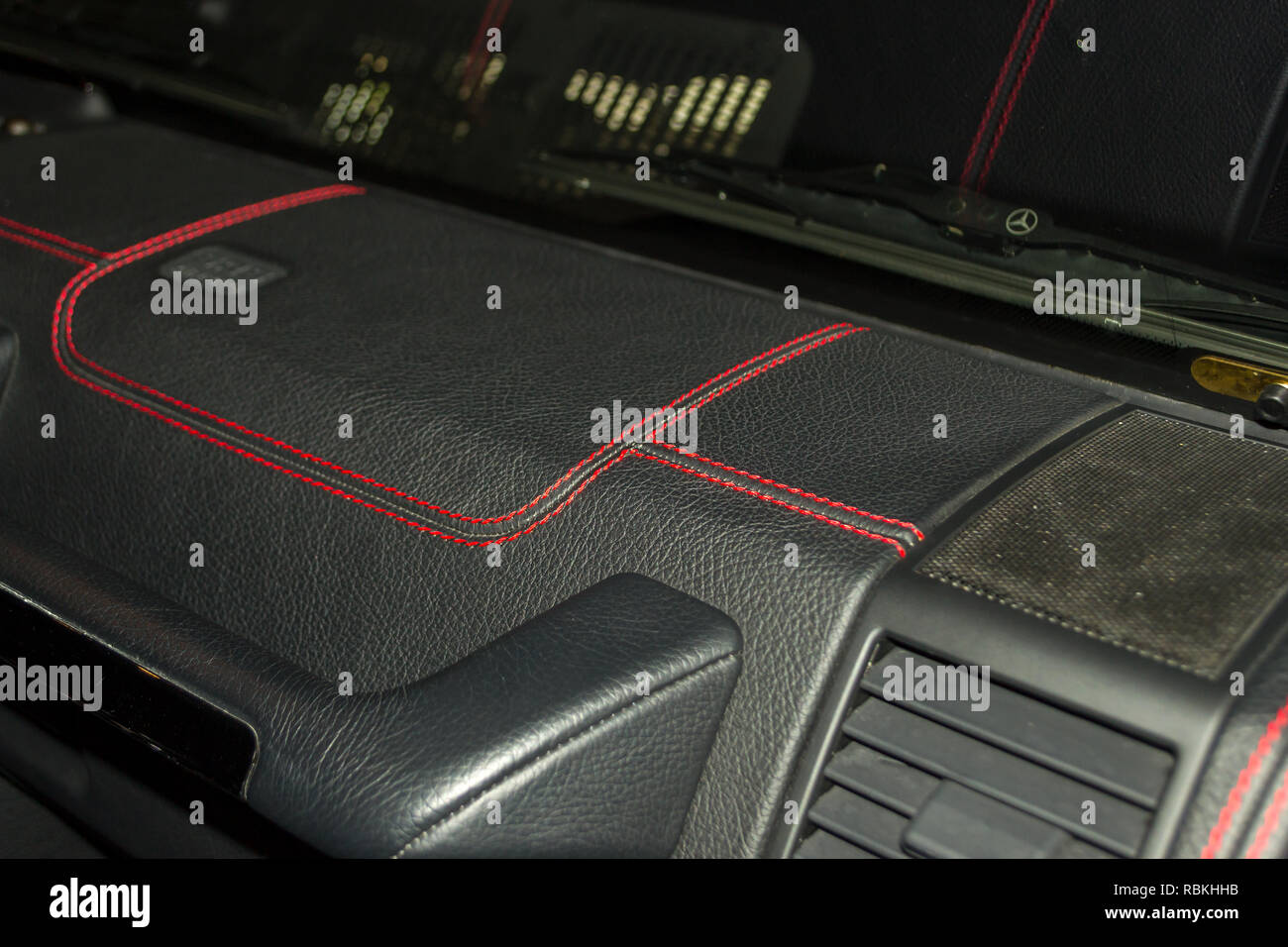 A view of a part of the interior of the car panel from leather of black ...