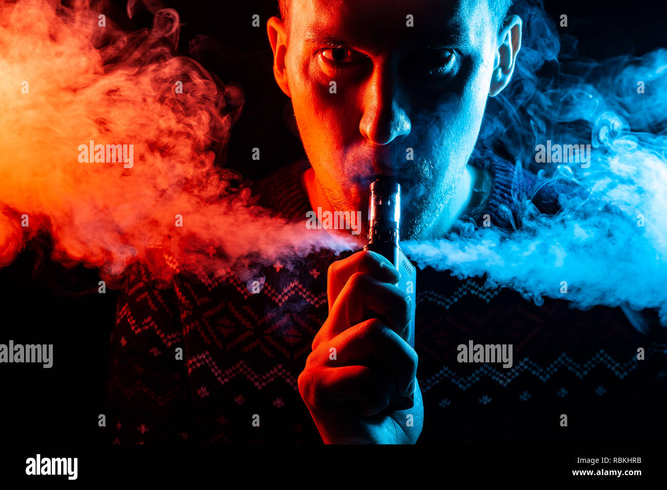 Portrait of a guy with a shadow on a serious face with a colored ...