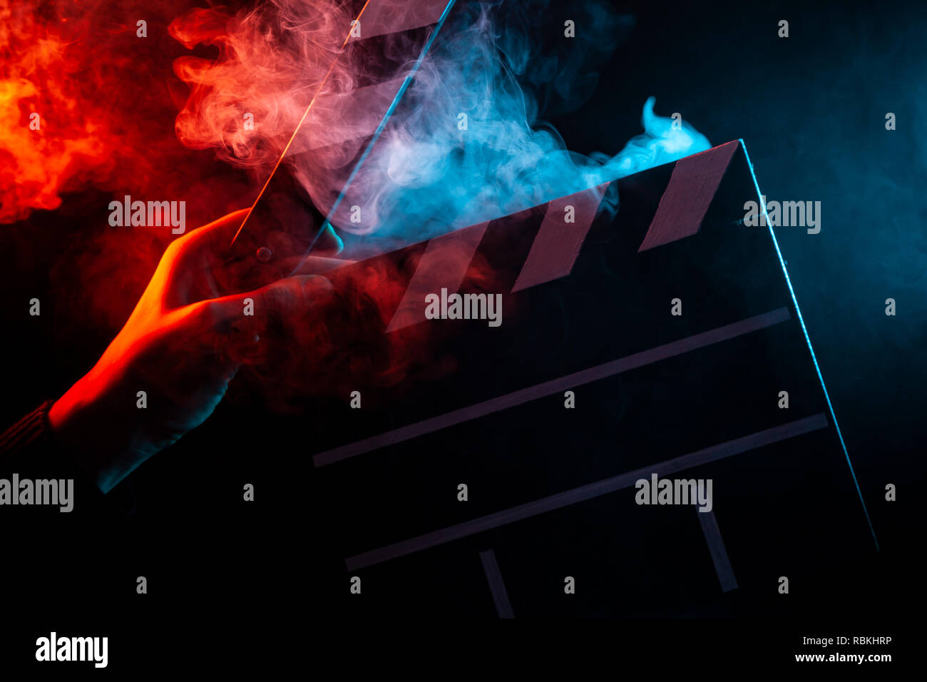 Close-up on an open clapper in hand before starting shooting a film ...