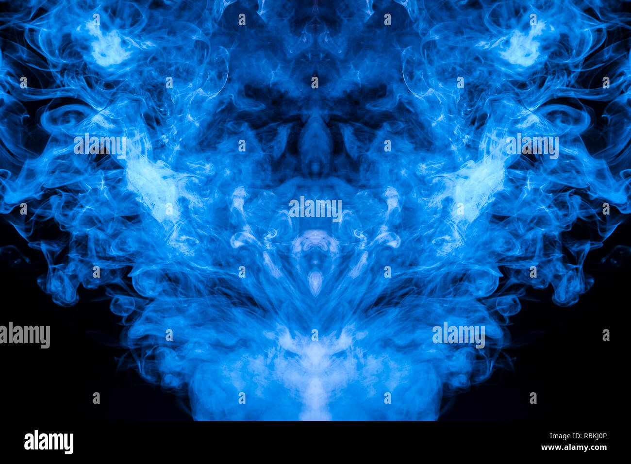 A multi-colored pattern of blue smoke of a mystical shape in the form ...