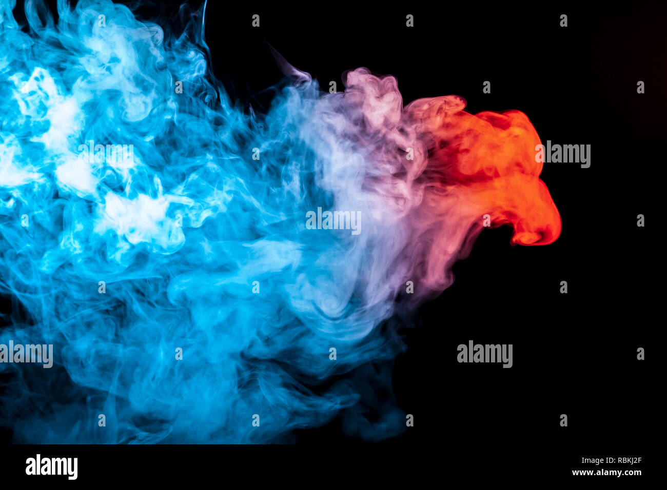 A multi-colored pattern of blue and red smoke of a mystical shape in ...