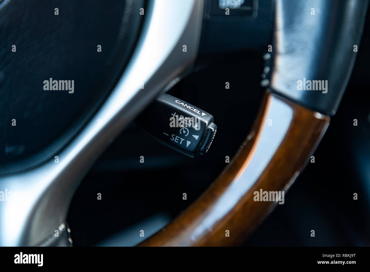 The shift lever to set the automatic cruise control speed inside the ...