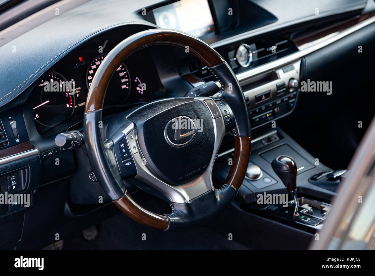 Modern steering wheel with wood elements and metallic chrome parts in ...