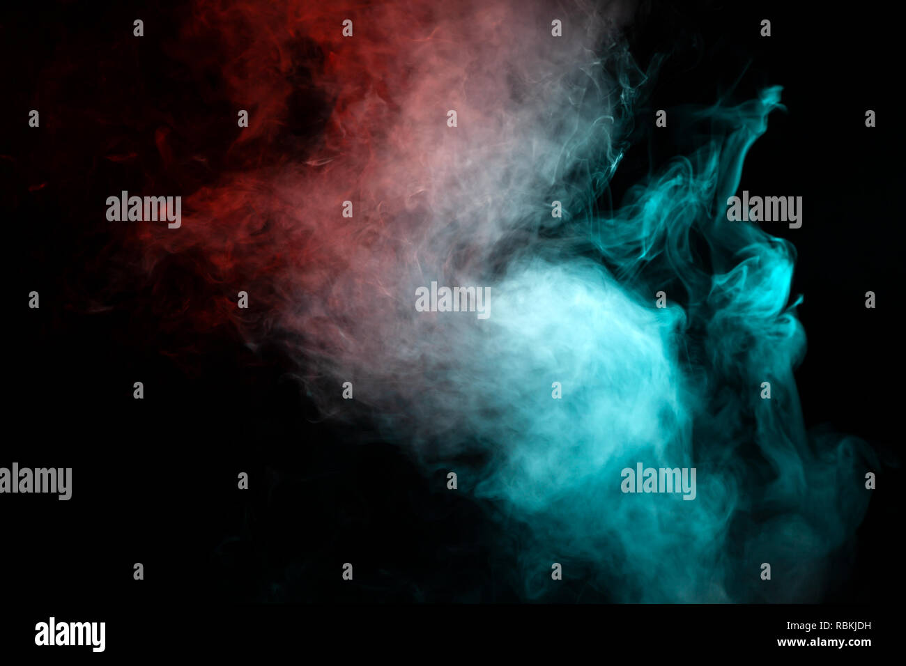 Translucent smoke rising to the top, illuminated by light on a dark ...