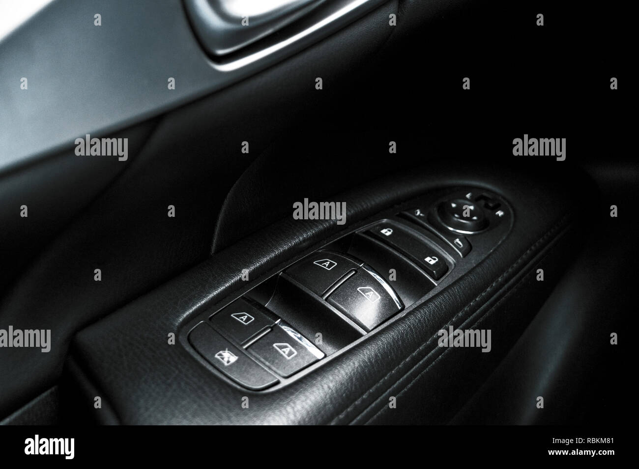 Car black perforated leather interior details of door handle with ...