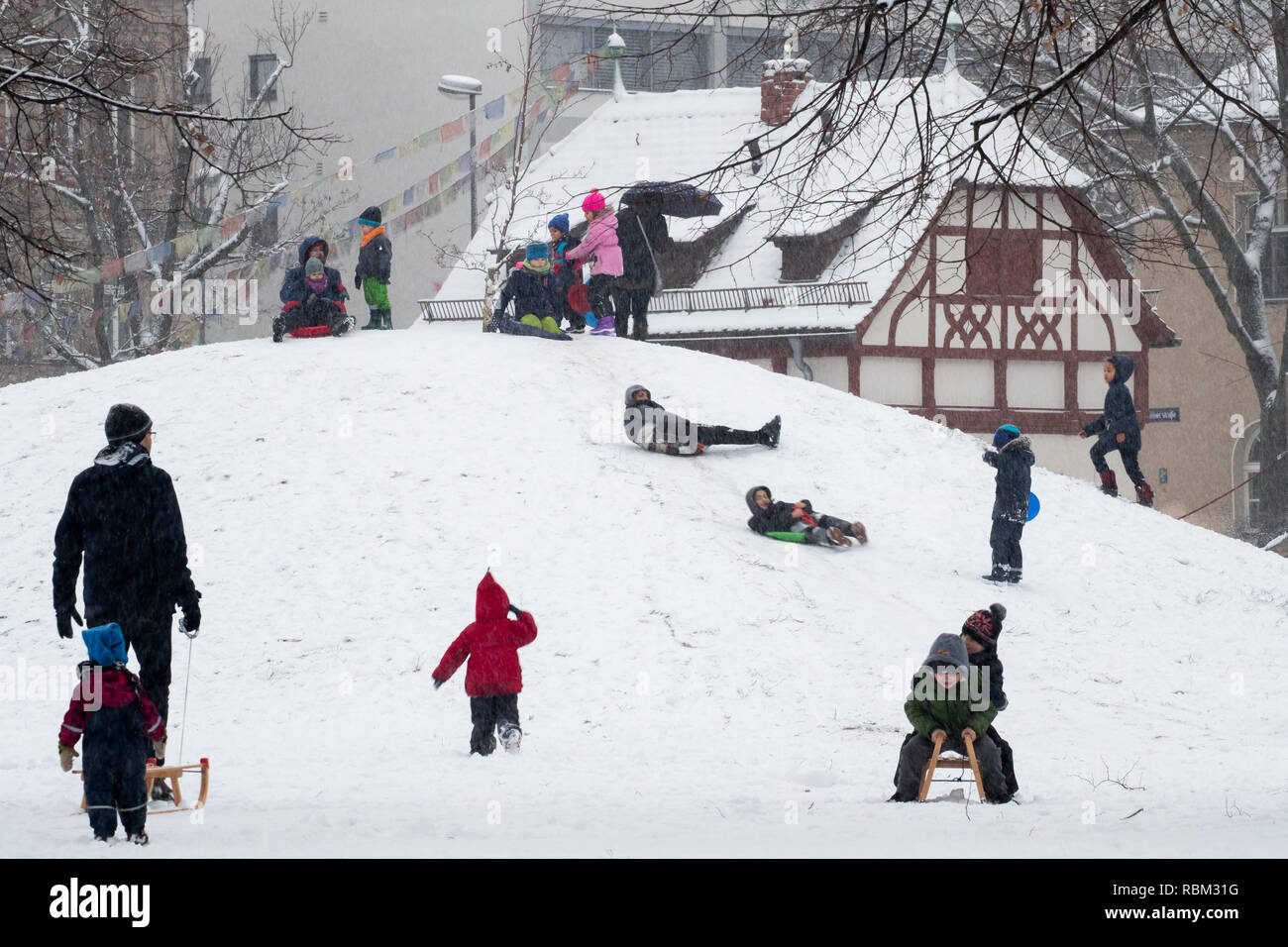 Nuremberg, Germany. 11th Jan 2019.Children slide on sledges down a snow ...