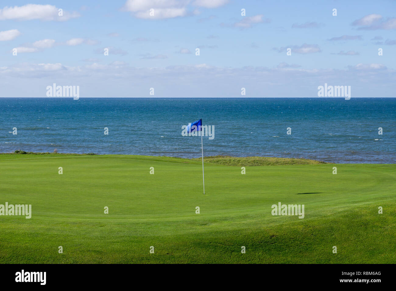 Golf course blue flag Stock Photo - Alamy