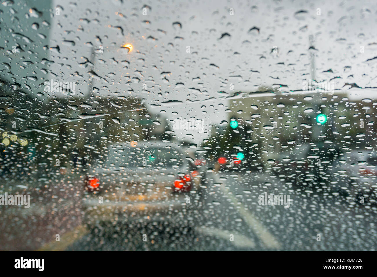 Raindrops on the windshield while driving through San Francisco on a rainy day, California Stock ...