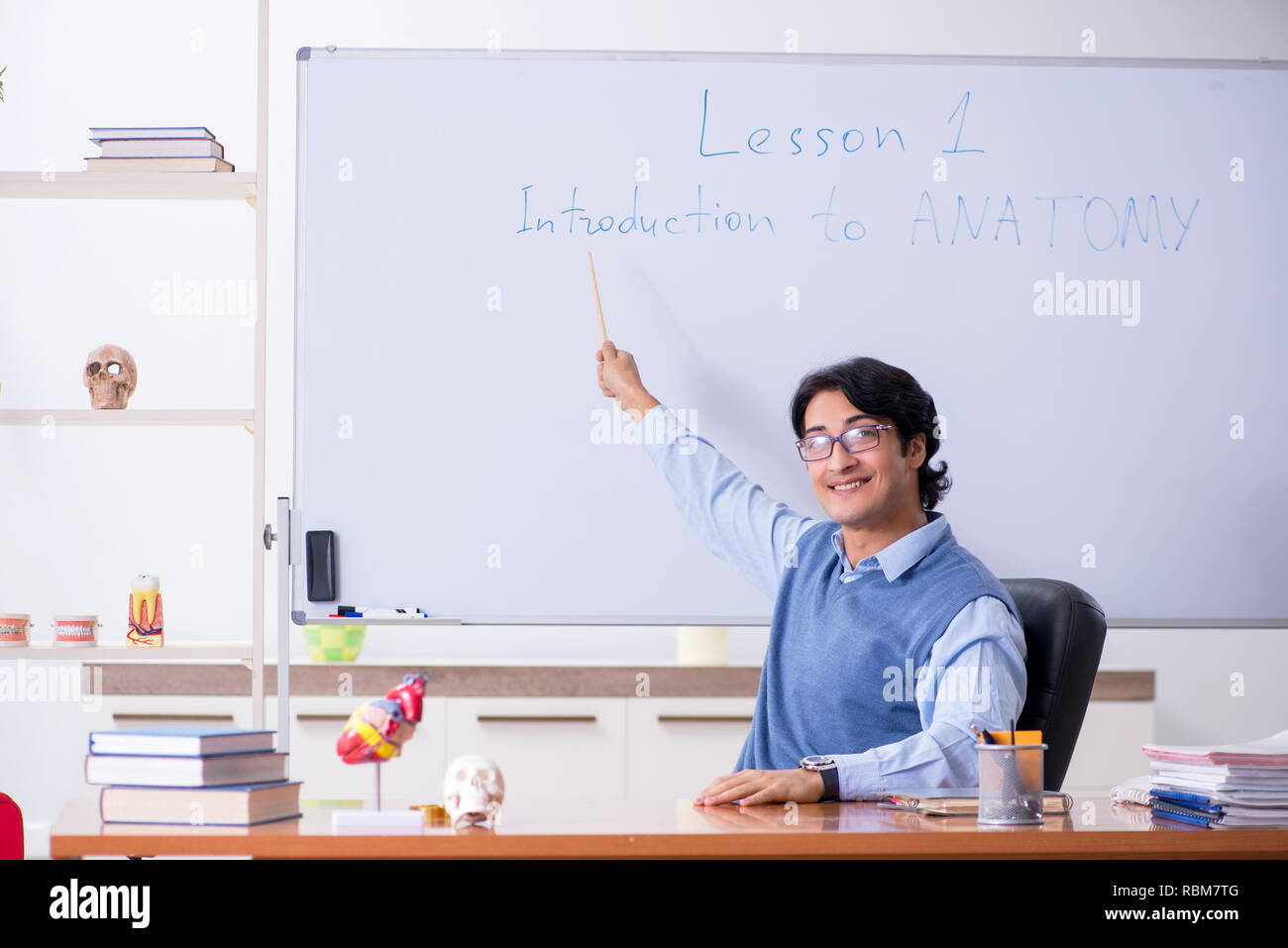 Young lecturer teacher teaching anatomy Stock Photo - Alamy