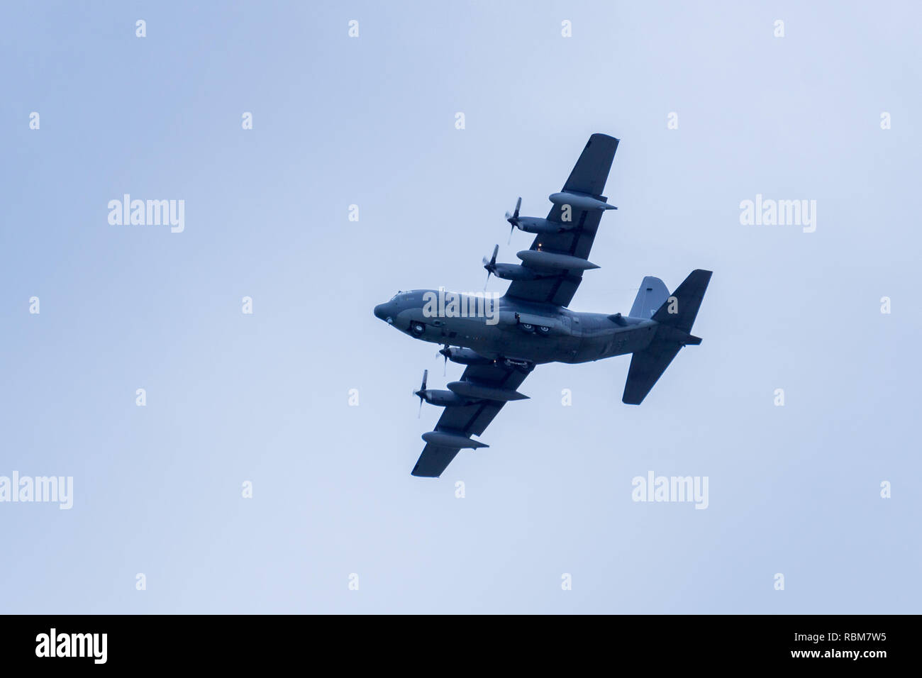 Large military airplane flying low, California Stock Photo - Alamy