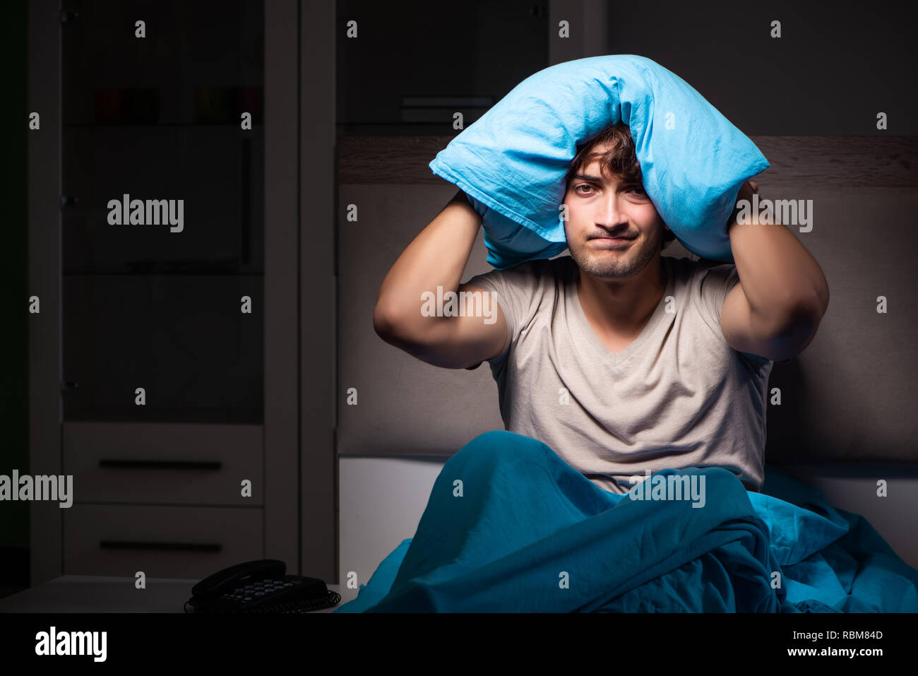 Angry man listening can hi-res stock photography and images - Alamy