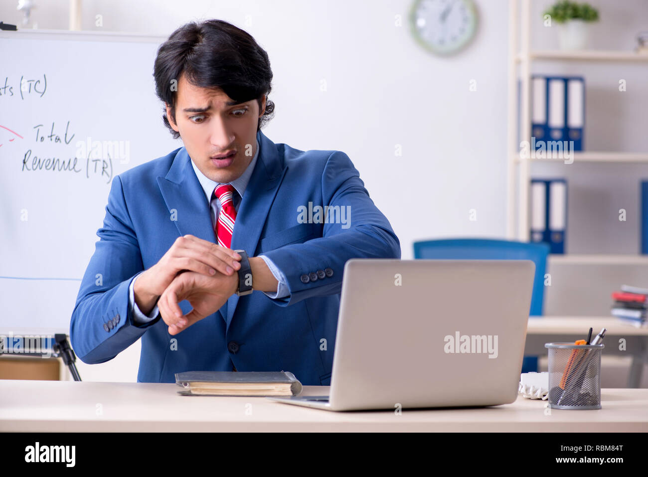 Busy businessman explaining business charts Stock Photo - Alamy
