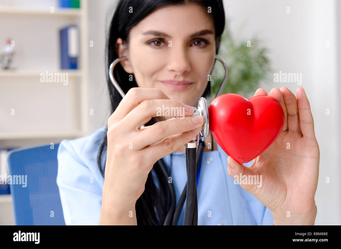 Female doctor cardiologist working in the clinic Stock Photo - Alamy