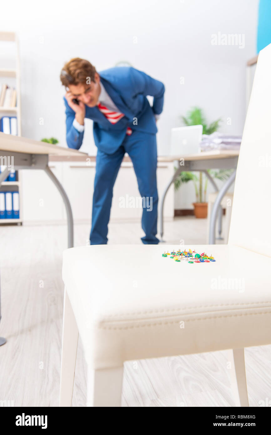 Office prank with sharp thumbtacks on chair Stock Photo - Alamy