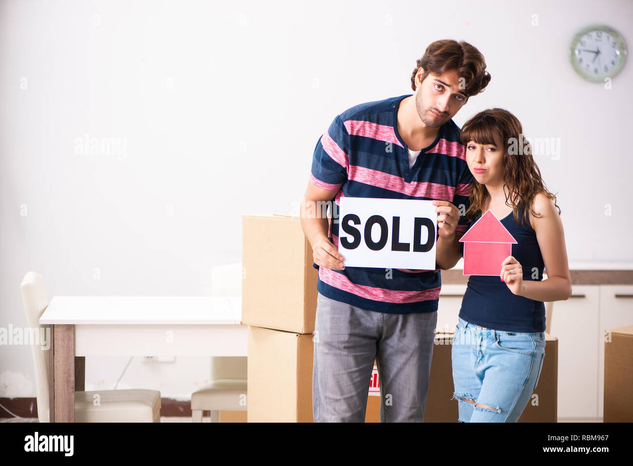 Young family selling their house Stock Photo - Alamy