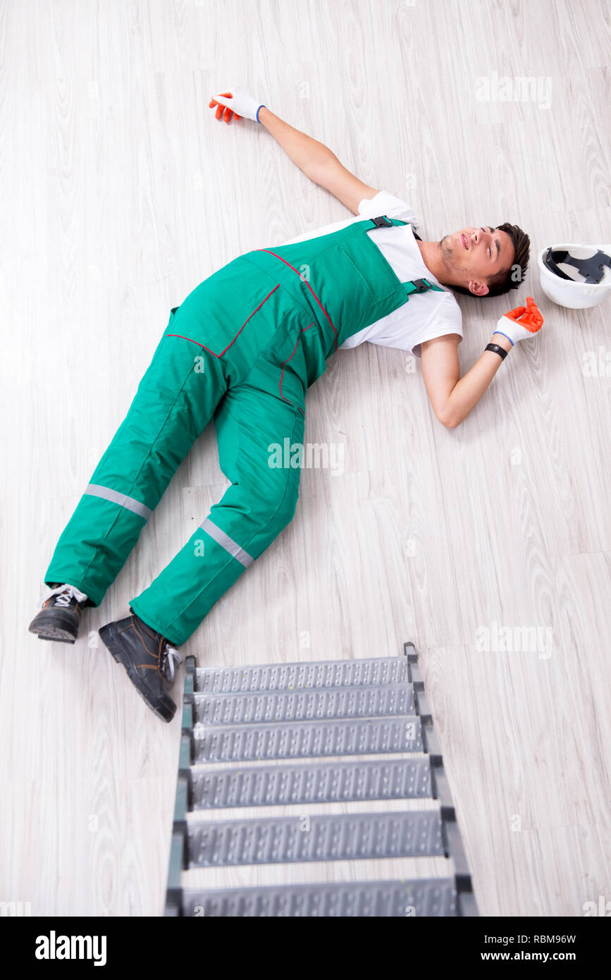 Young worker falling from the ladder Stock Photo - Alamy