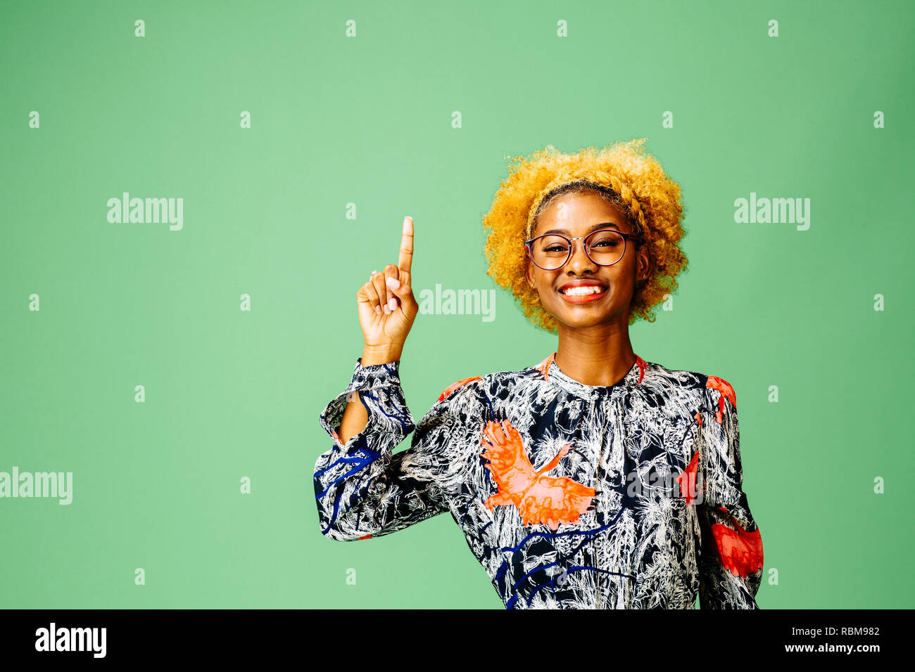 Smiling Afro American Woman Pointing High Resolution Stock Photography ...