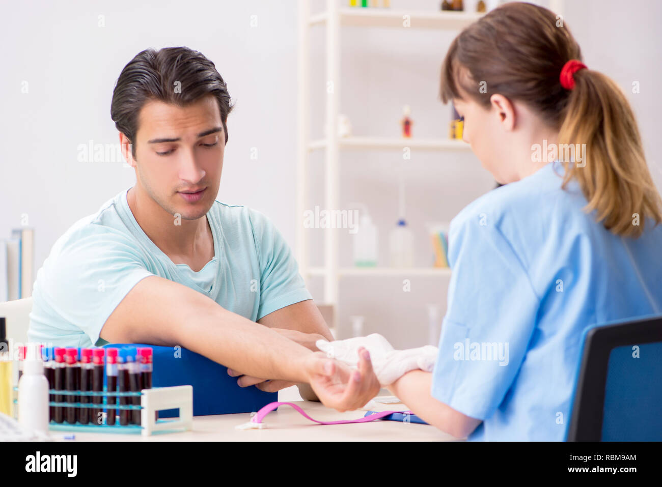 Young patient during blood test sampling procedure Stock Photo - Alamy