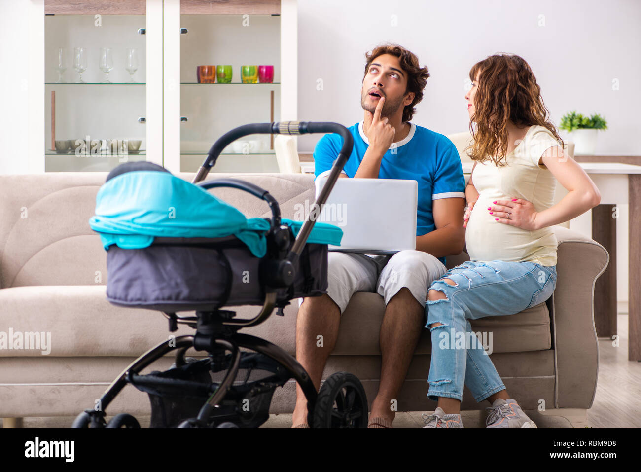 Concerned couple with baby hi-res stock photography and images - Alamy