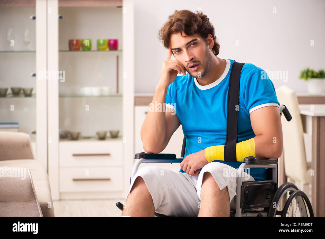 Injured man recovering from his injury Stock Photo - Alamy