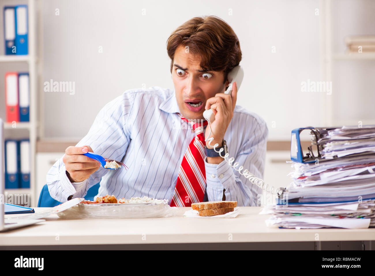 Employee eating food with cockroaches crawling around Stock Photo - Alamy