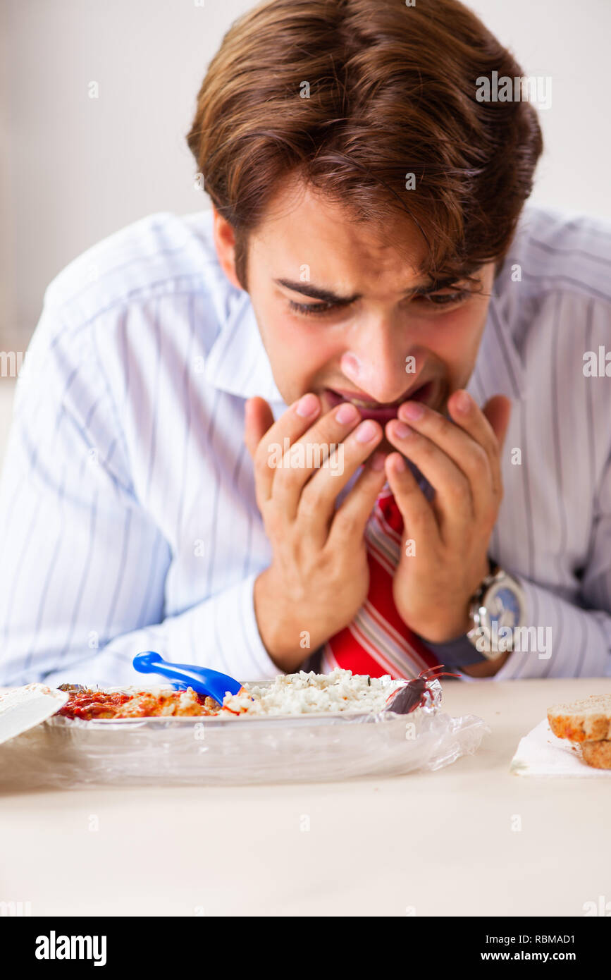 Employee eating food with cockroaches crawling around Stock Photo - Alamy
