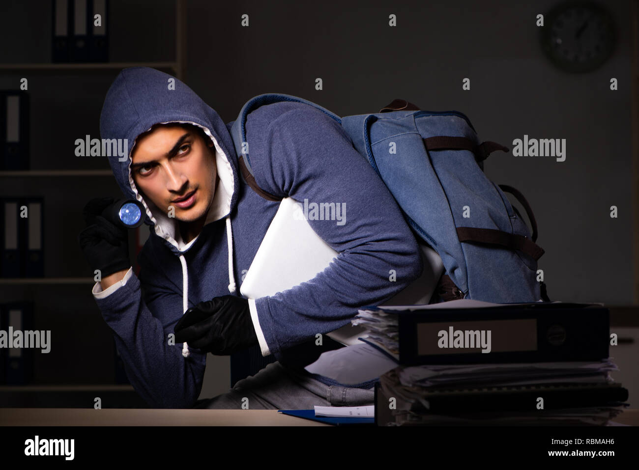 Thief trying to steal personal data in identity theft concept Stock ...