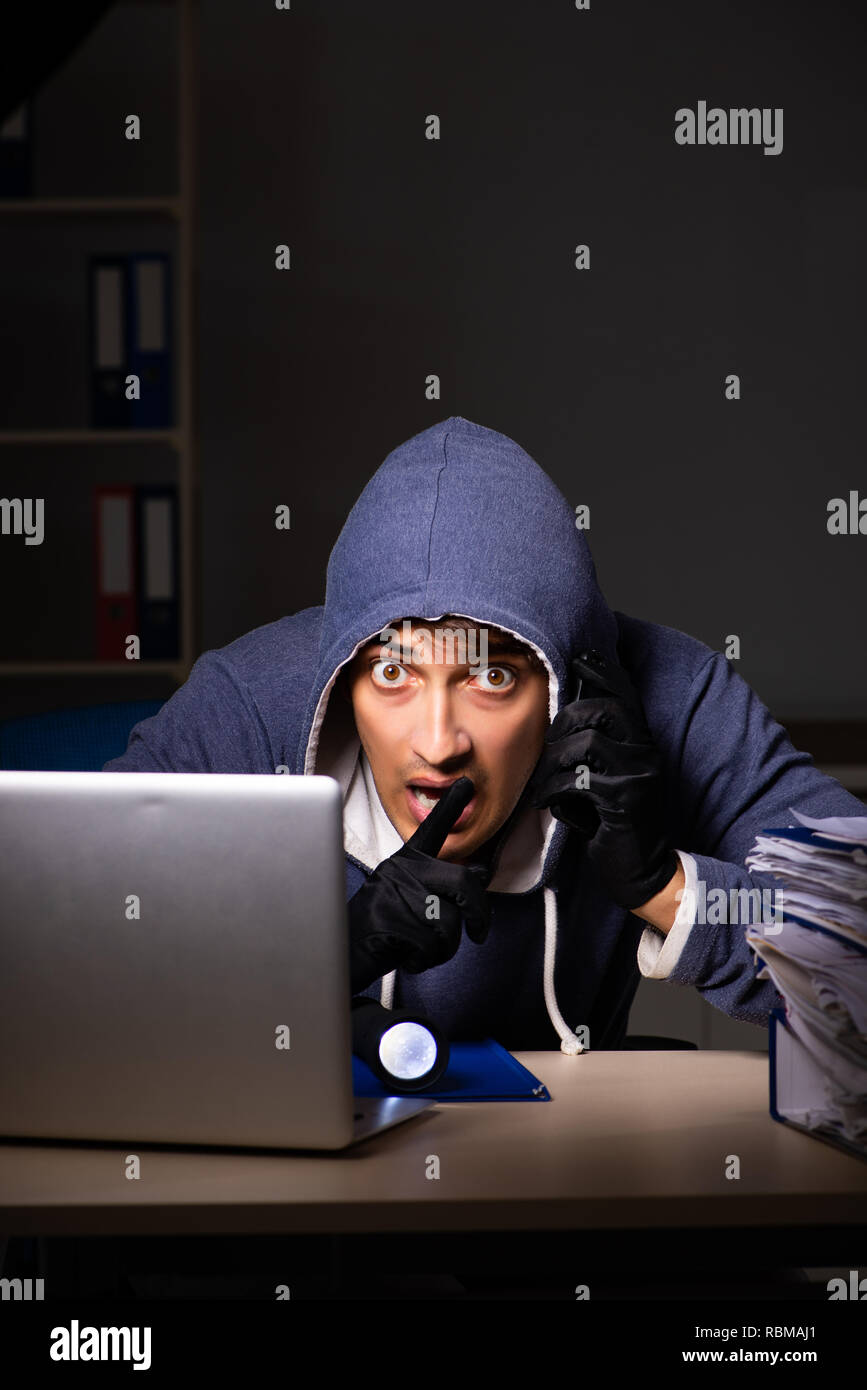 Thief trying to steal personal data in identity theft concept Stock ...