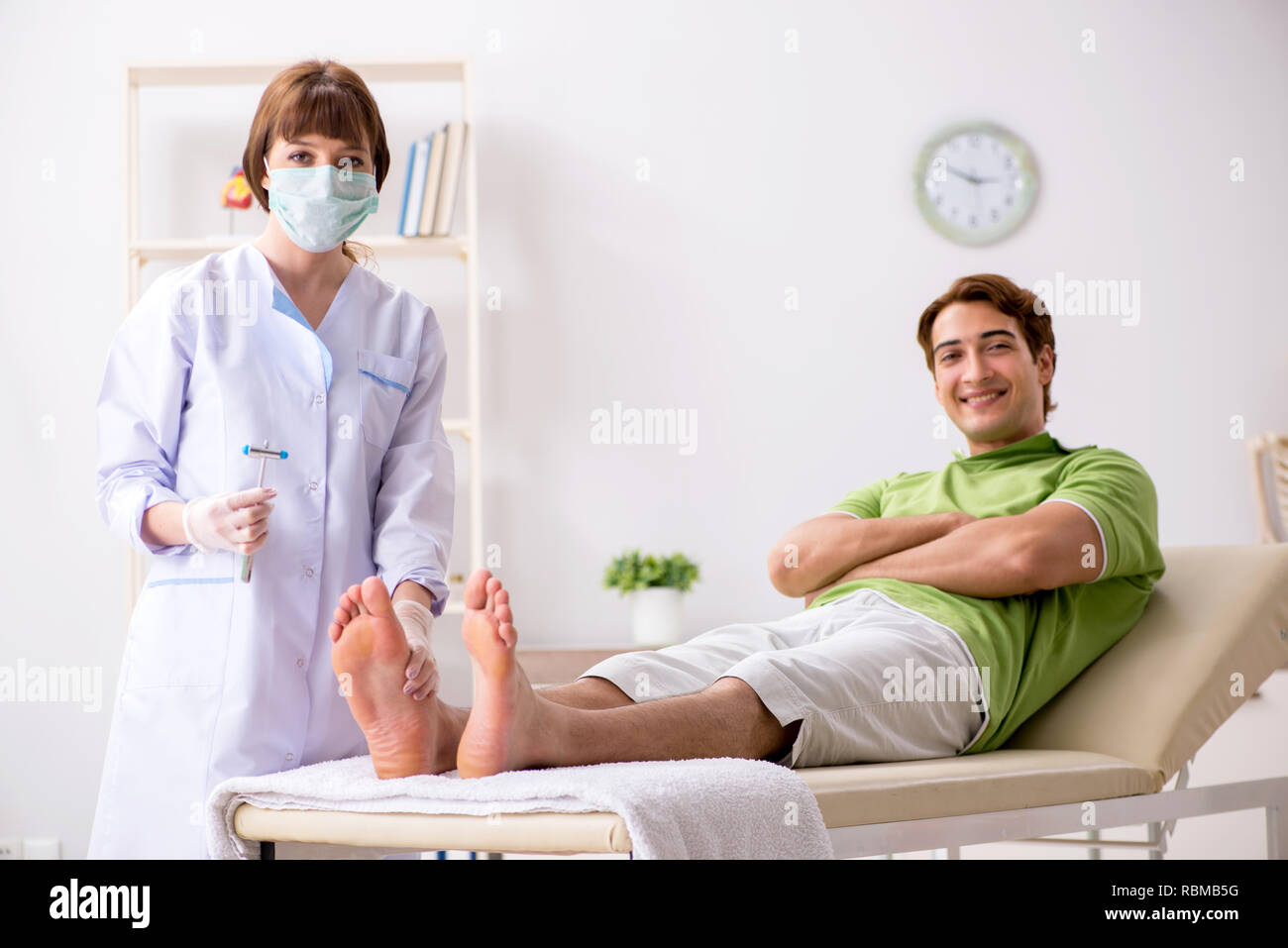 Podiatrist treating feet during procedure Stock Photo - Alamy