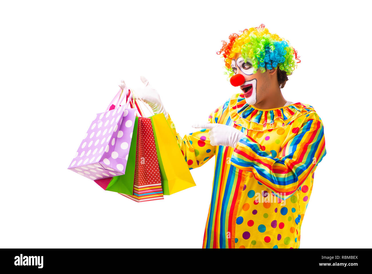 Happy male clown holding present hi-res stock photography and images ...