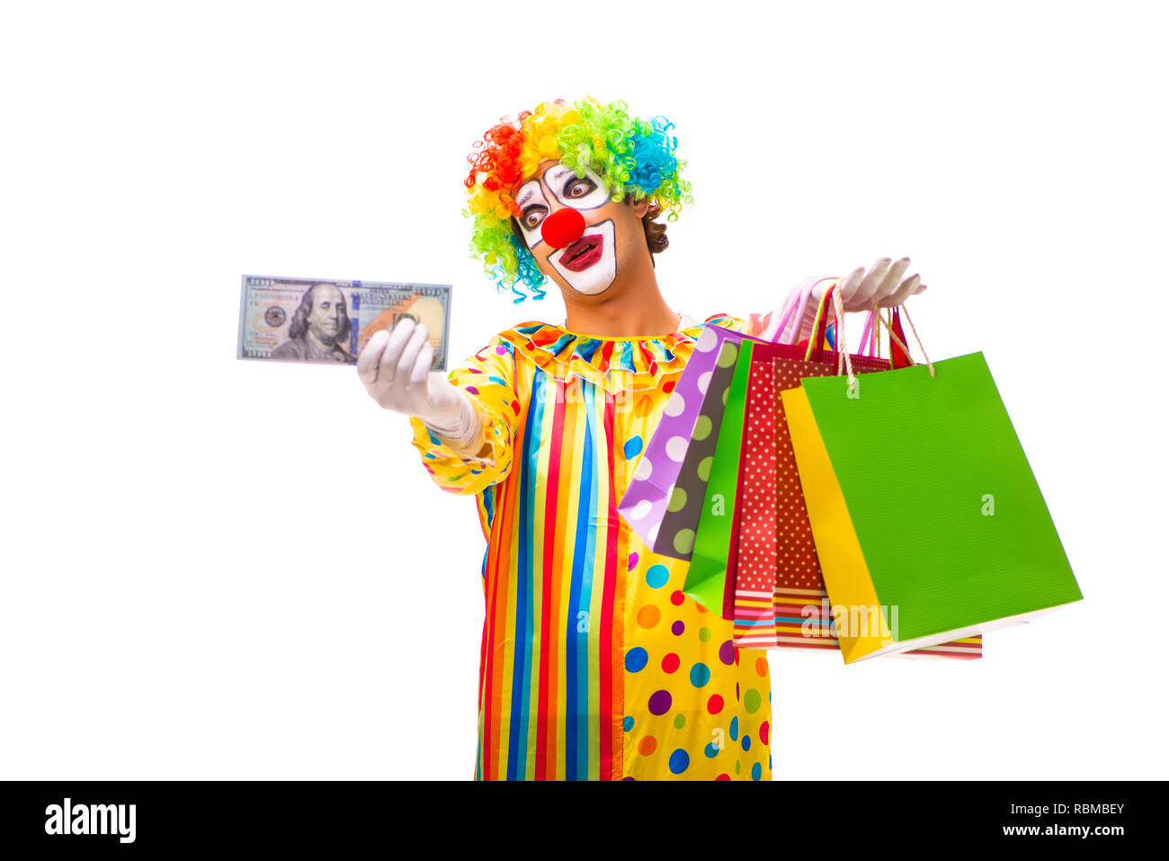 Happy male clown holding present hi-res stock photography and images ...