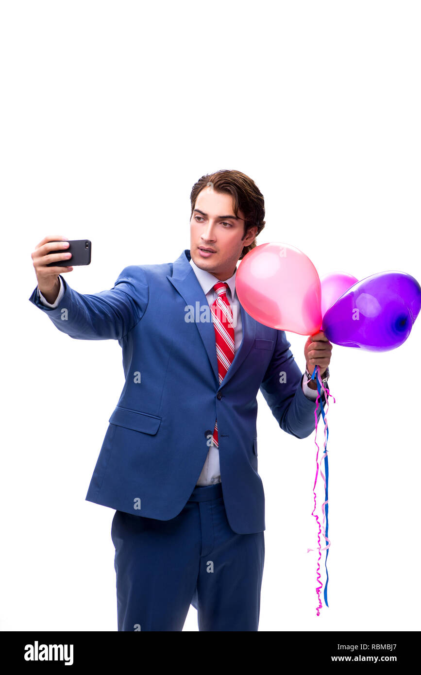 Elegant businessman with balloons isolated on white Stock Photo - Alamy