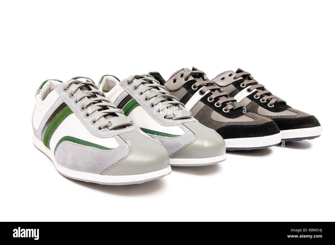 Selection of trainers isolated on white Stock Photo - Alamy