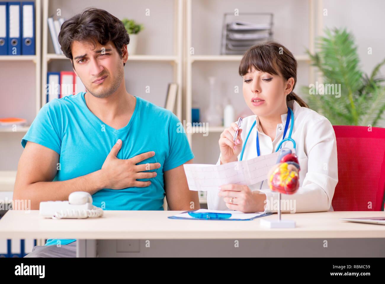 Young patient visiting doctor cardiologist Stock Photo - Alamy