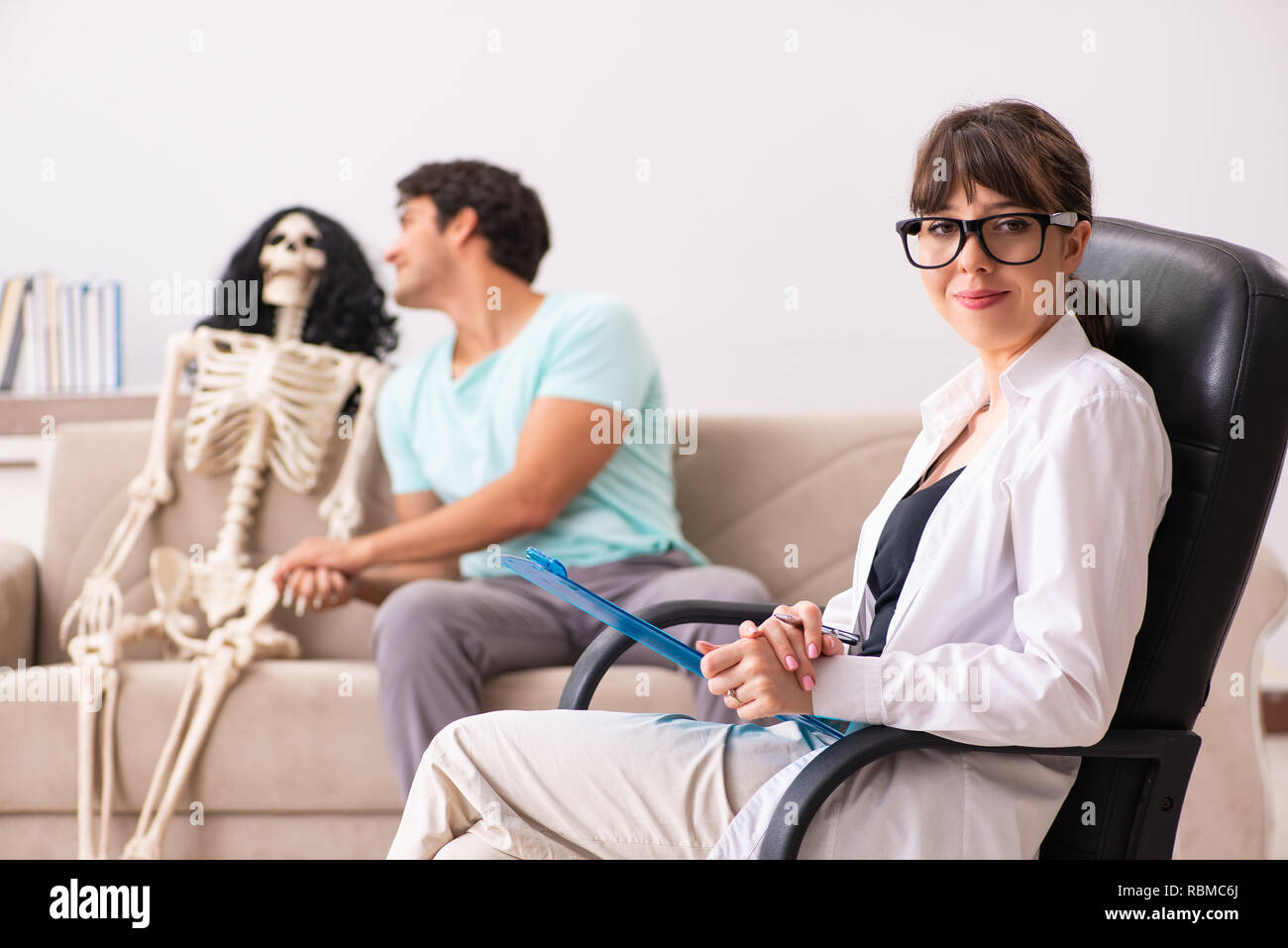 Young patient visiting psychologist for therapy Stock Photo - Alamy