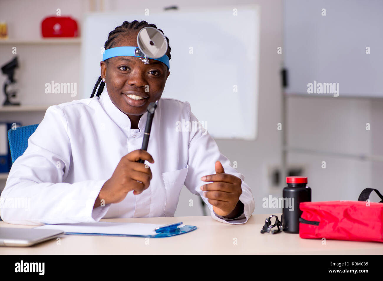 Black female doctor working at clinic Stock Photo - Alamy