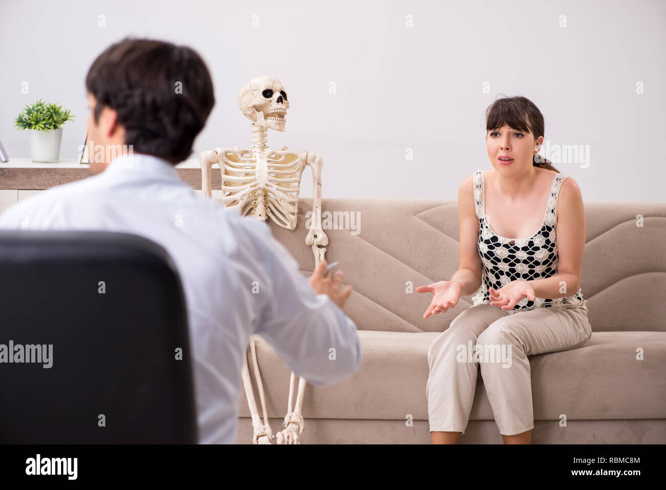 Young patient visiting psychologist for therapy Stock Photo - Alamy