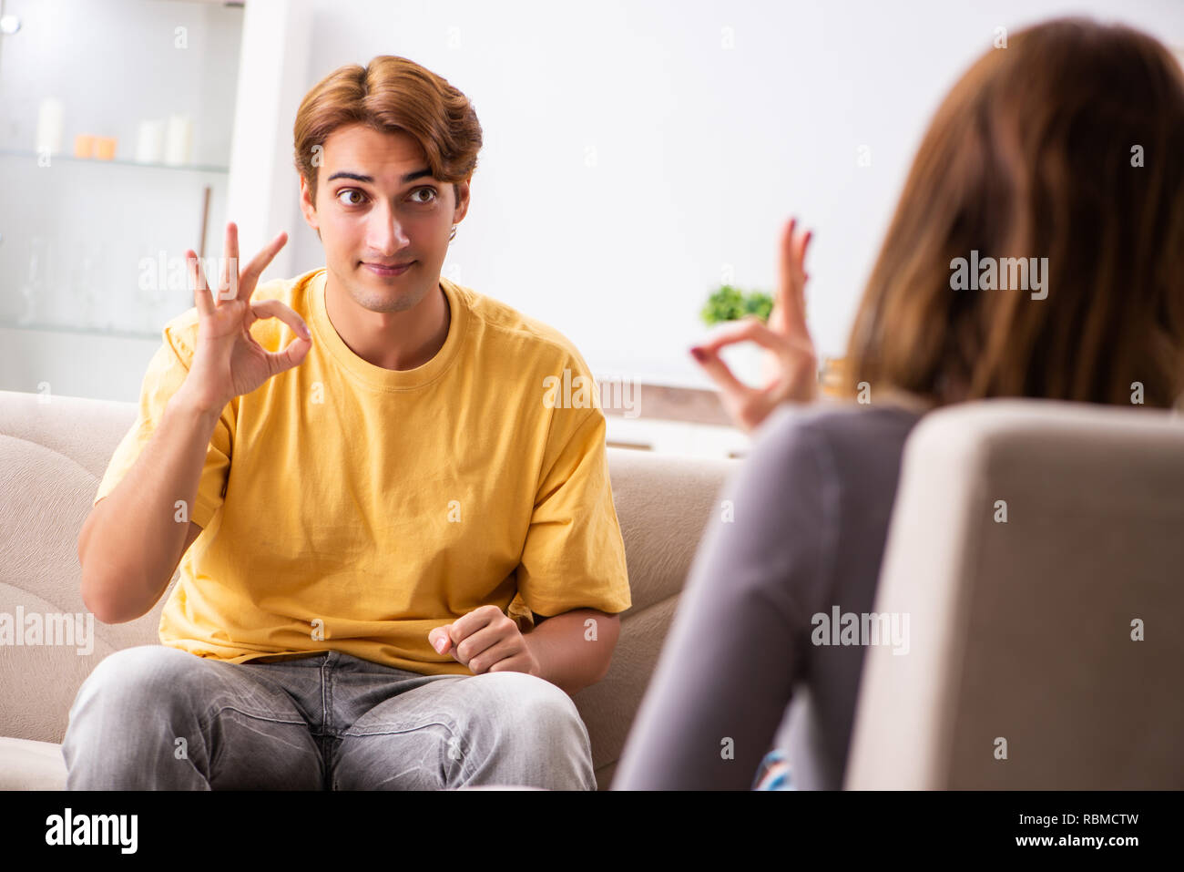 Woman and man learning sign language Stock Photo - Alamy
