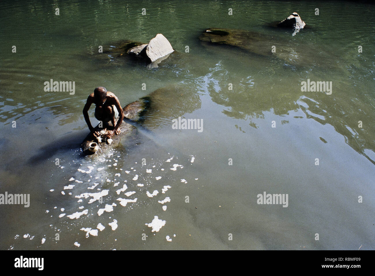 Man washing clothes in river, Chitrakoot, Uttar Pradesh, India, Asia ...