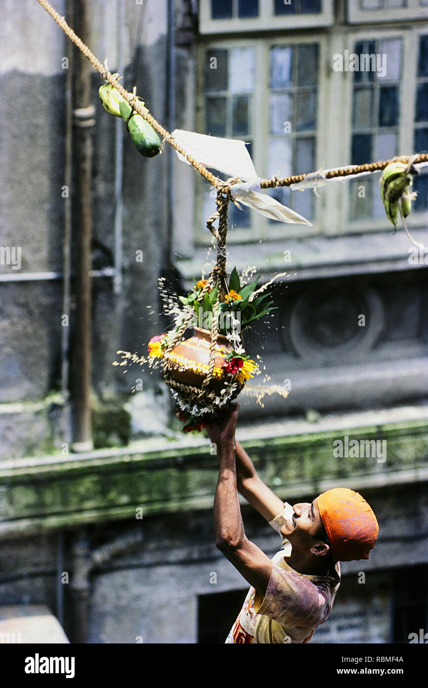 Boy breaking Dahi Handi, Janmashtami festival, Mumbai, India, Asia ...