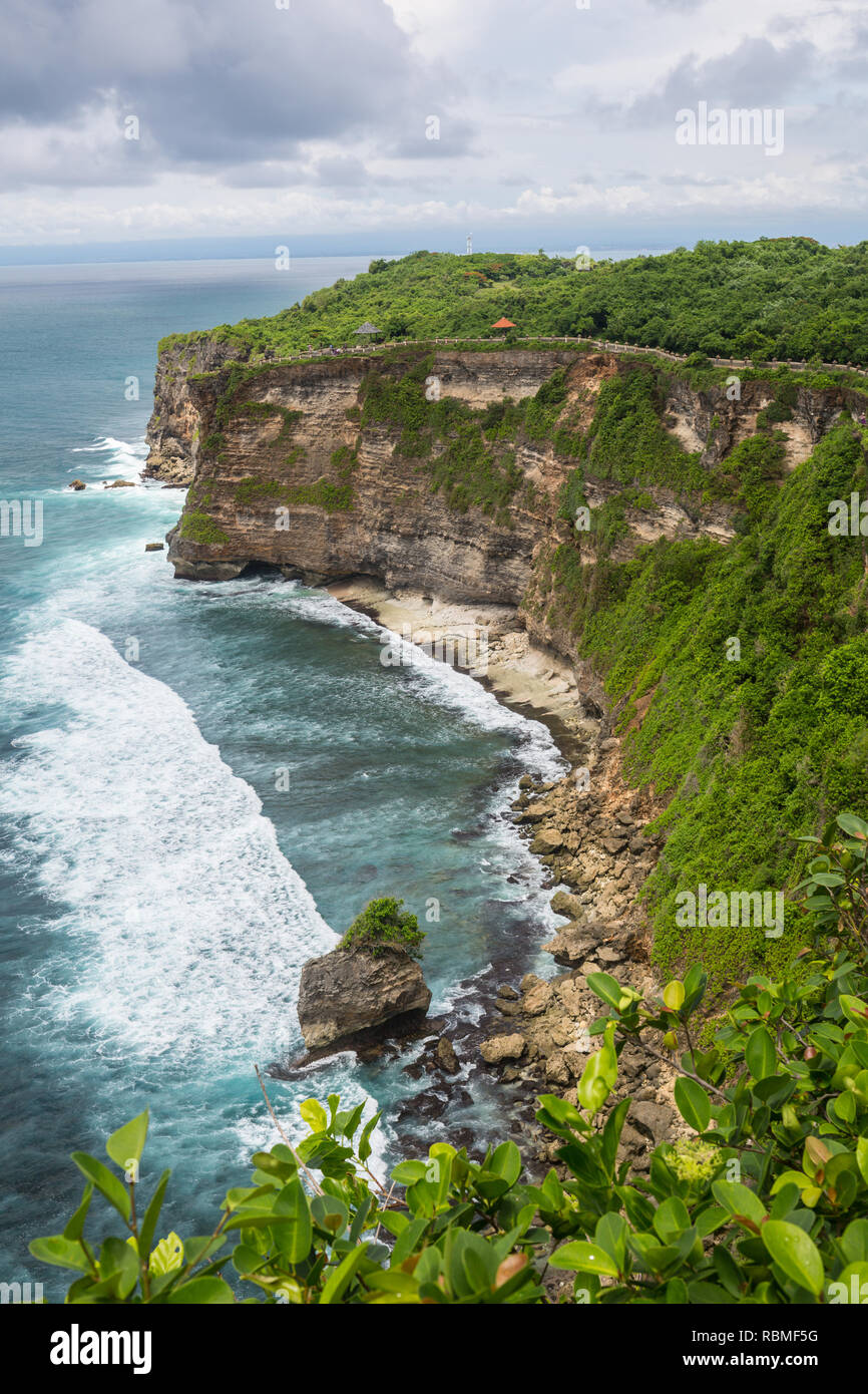 View of Uluwatu cliff with pavilion and blue sea in Bali, Indonesia ...