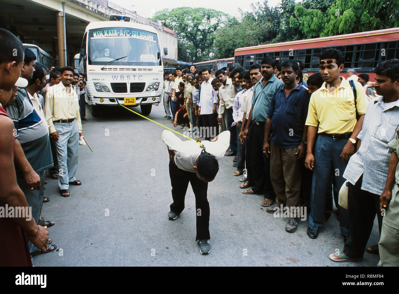 Sailendra Nath Roy pulling bus by his pony tail, India, Asia Stock ...